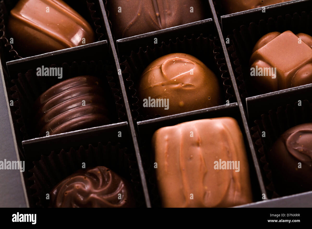 Box of assorted gourmet truffles on a white background Stock Photo - Alamy