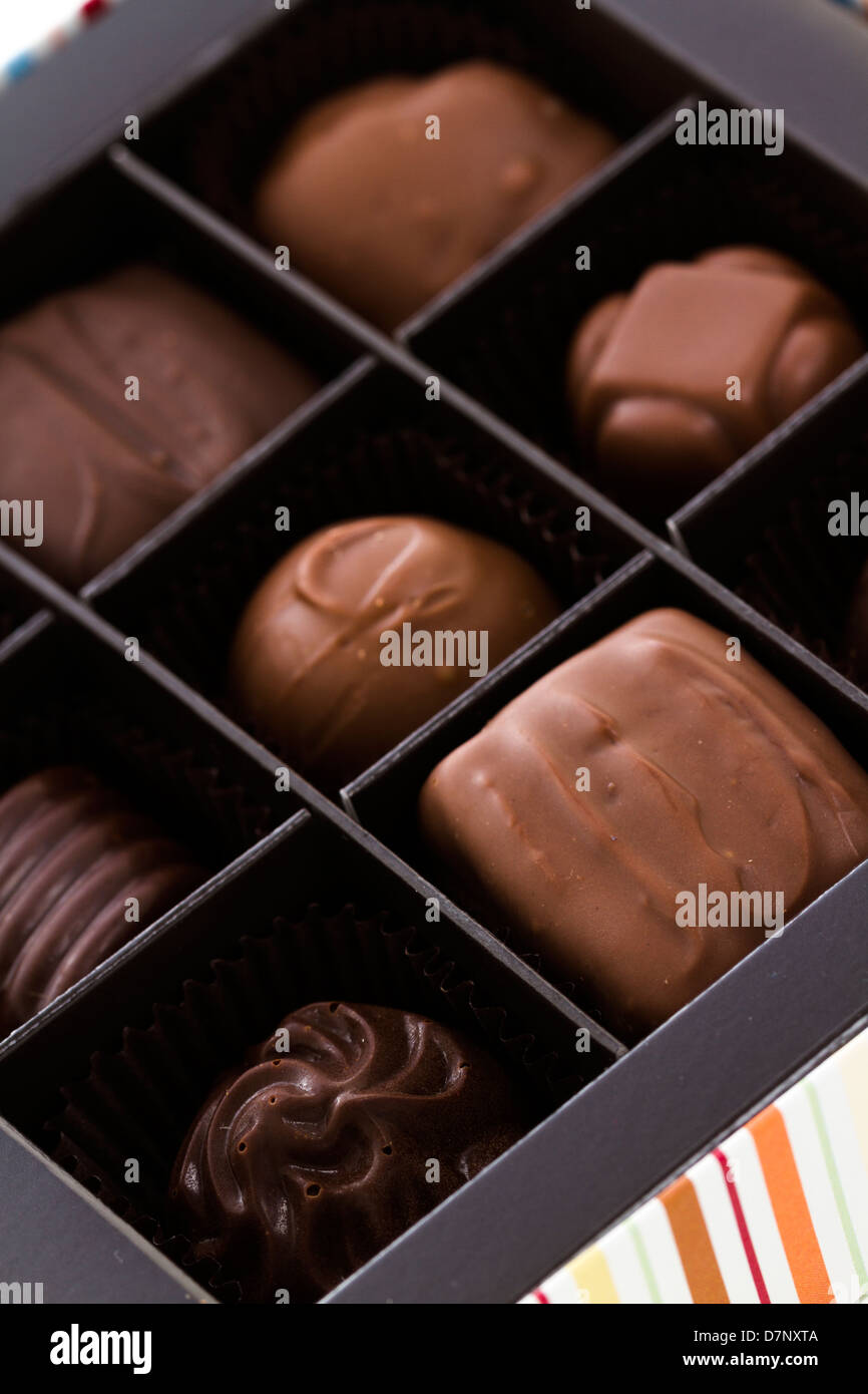 Box of assorted gourmet truffles on a white background Stock Photo - Alamy