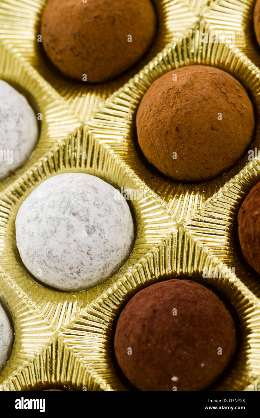Box of assorted gourmet truffles on a white background Stock Photo - Alamy