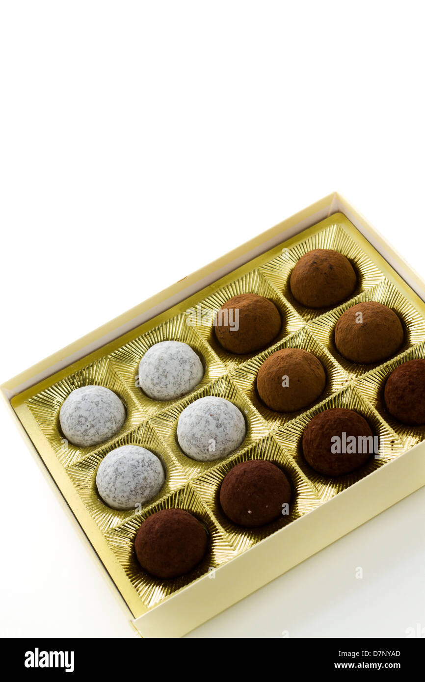 Box of assorted gourmet truffles on a white background Stock Photo - Alamy