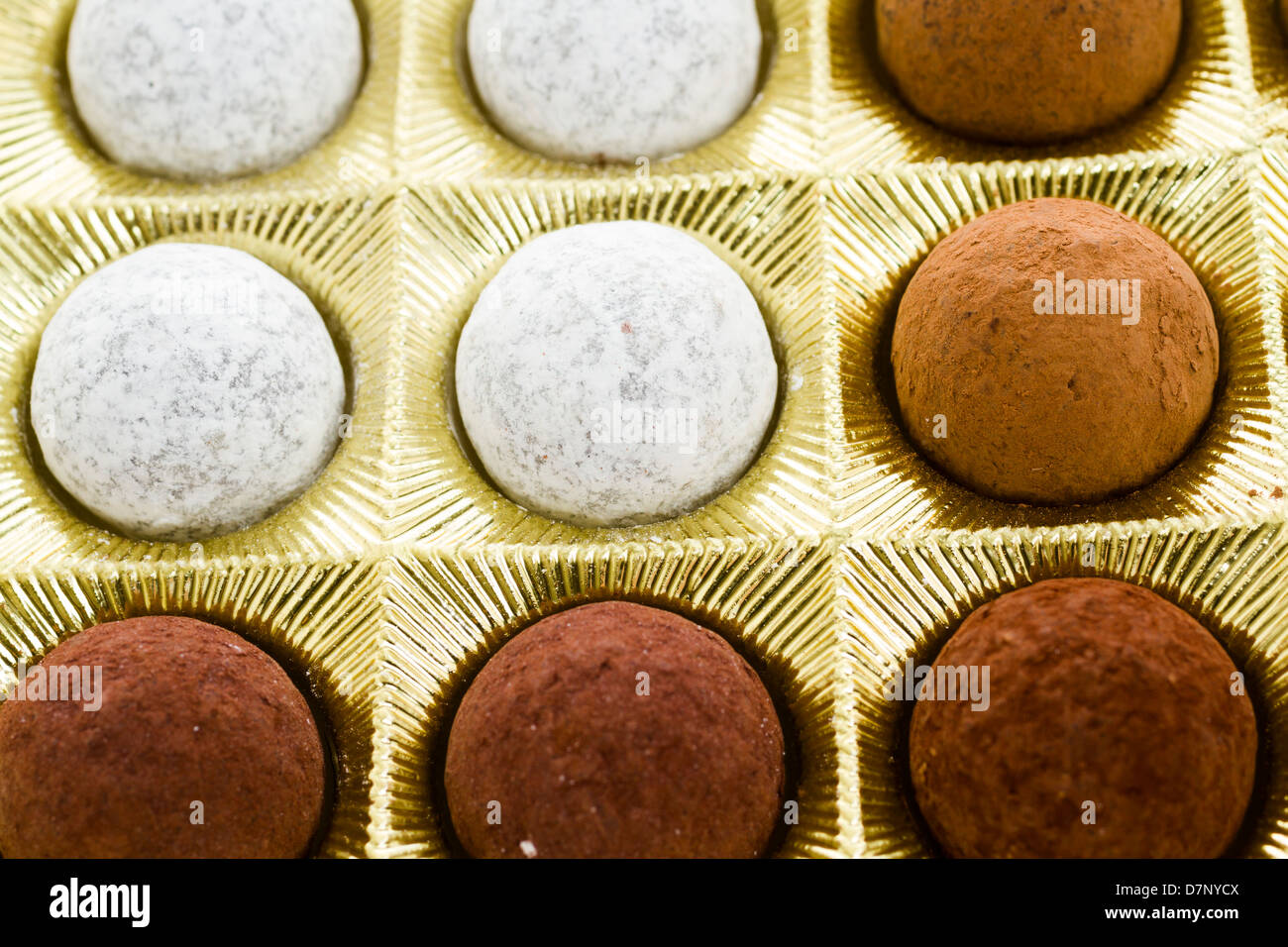 Box of assorted gourmet truffles on a white background Stock Photo - Alamy