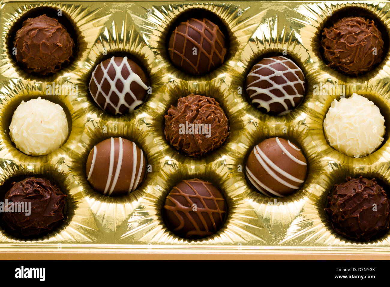 Box of assorted gourmet truffles on a white background Stock Photo - Alamy