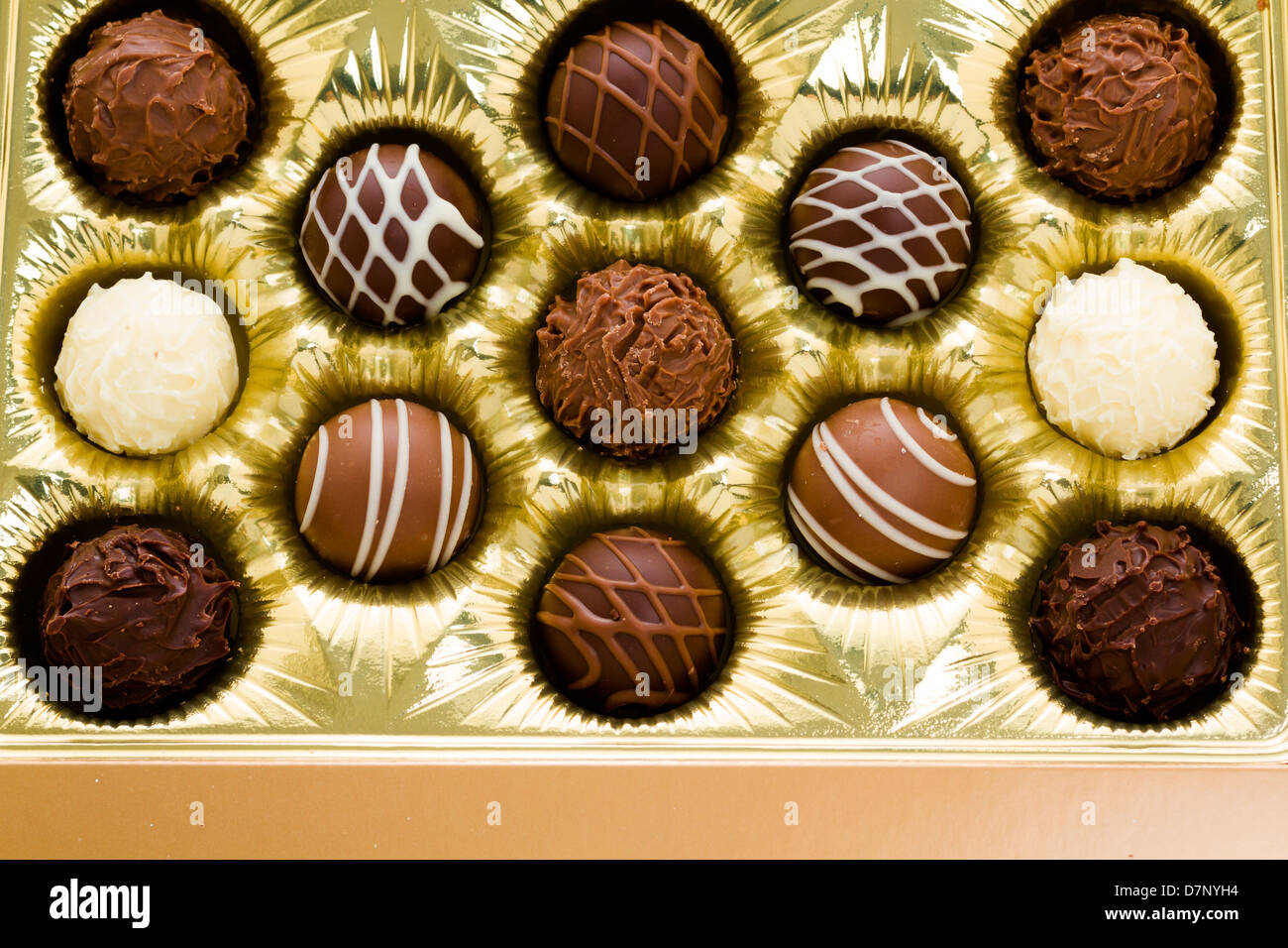 Box of assorted gourmet truffles on a white background Stock Photo - Alamy