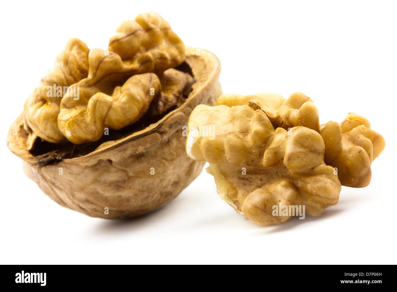 cracked walnuts cut out on white background Stock Photo - Alamy