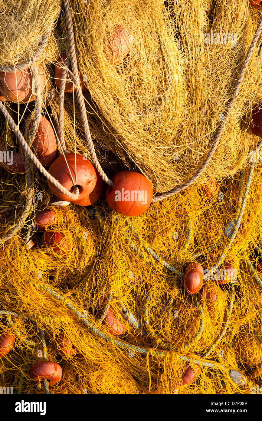 Bright yellow fishing nets Stock Photo - Alamy