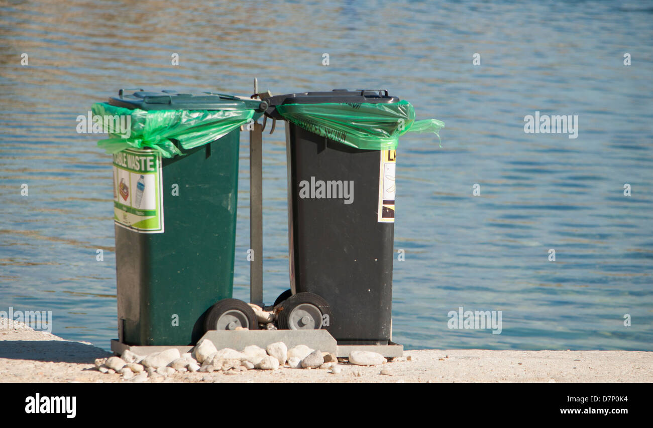 Bins by water Stock Photo - Alamy