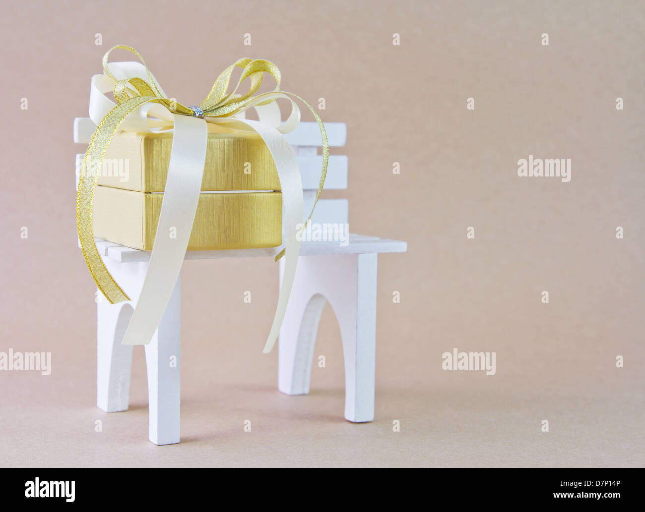 Gift box on the chair Stock Photo - Alamy