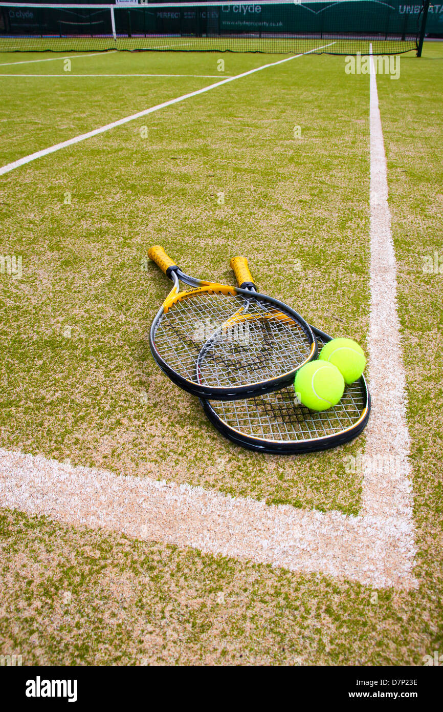 Tennis concept with racquet and balls Stock Photo - Alamy