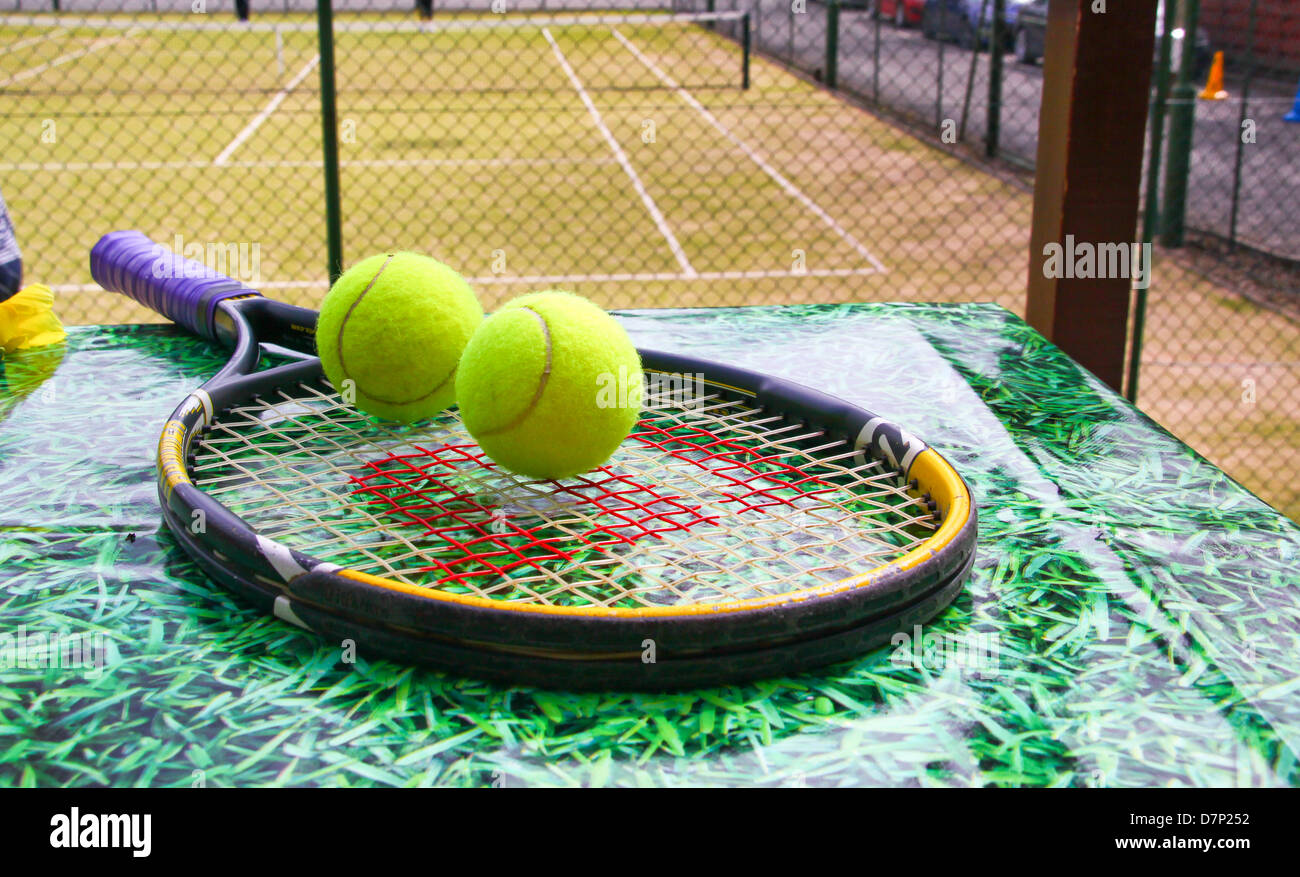 Tennis concept with racquet and balls Stock Photo - Alamy