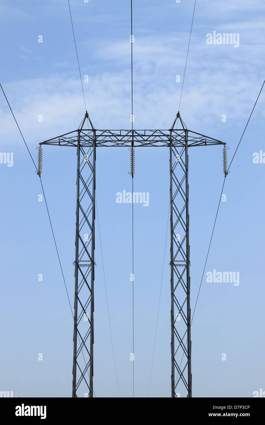 Power line tower on a blue sky background Stock Photo - Alamy