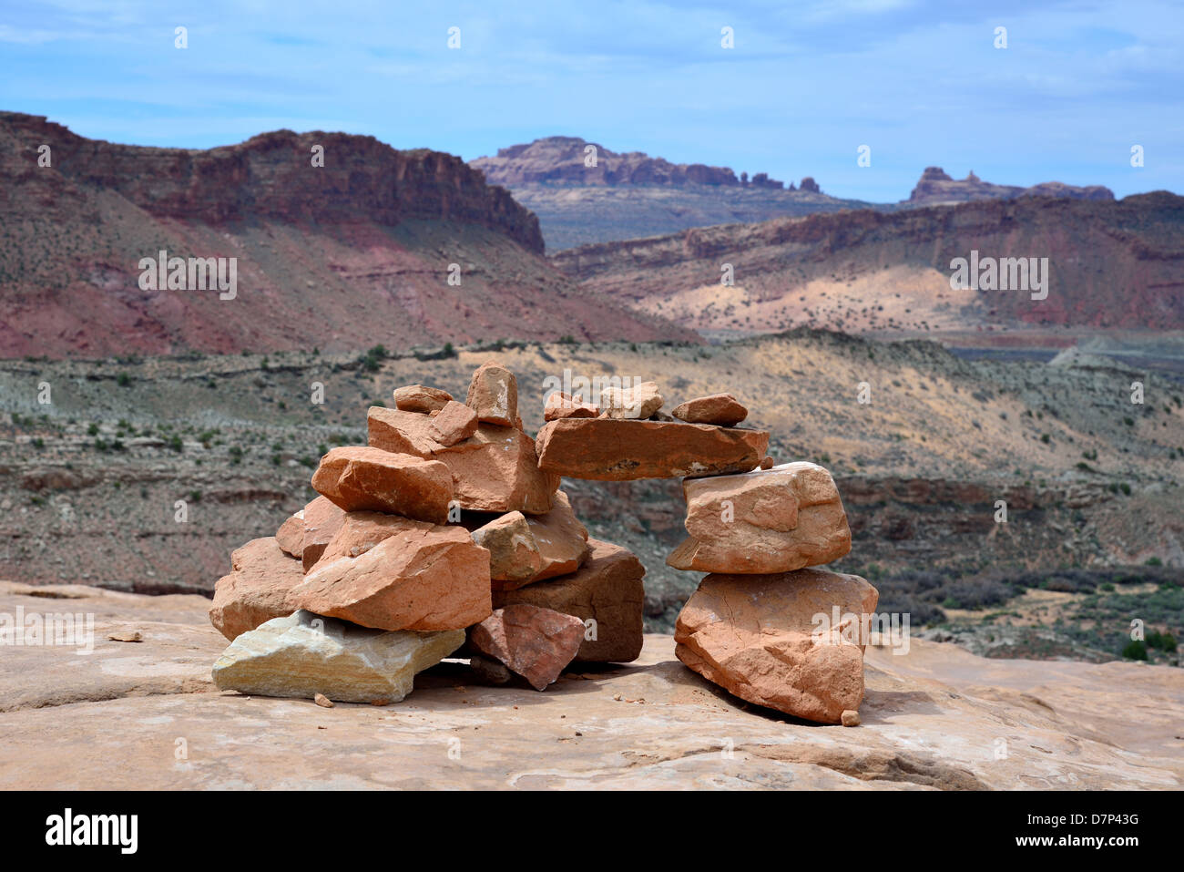 A small arch made of pile of rocks marks the trail head. Arches ...