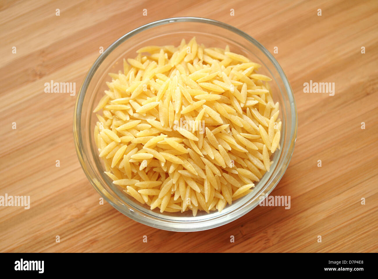 Risoni Pasta in a Glass Bowl;Top View Stock Photo - Alamy