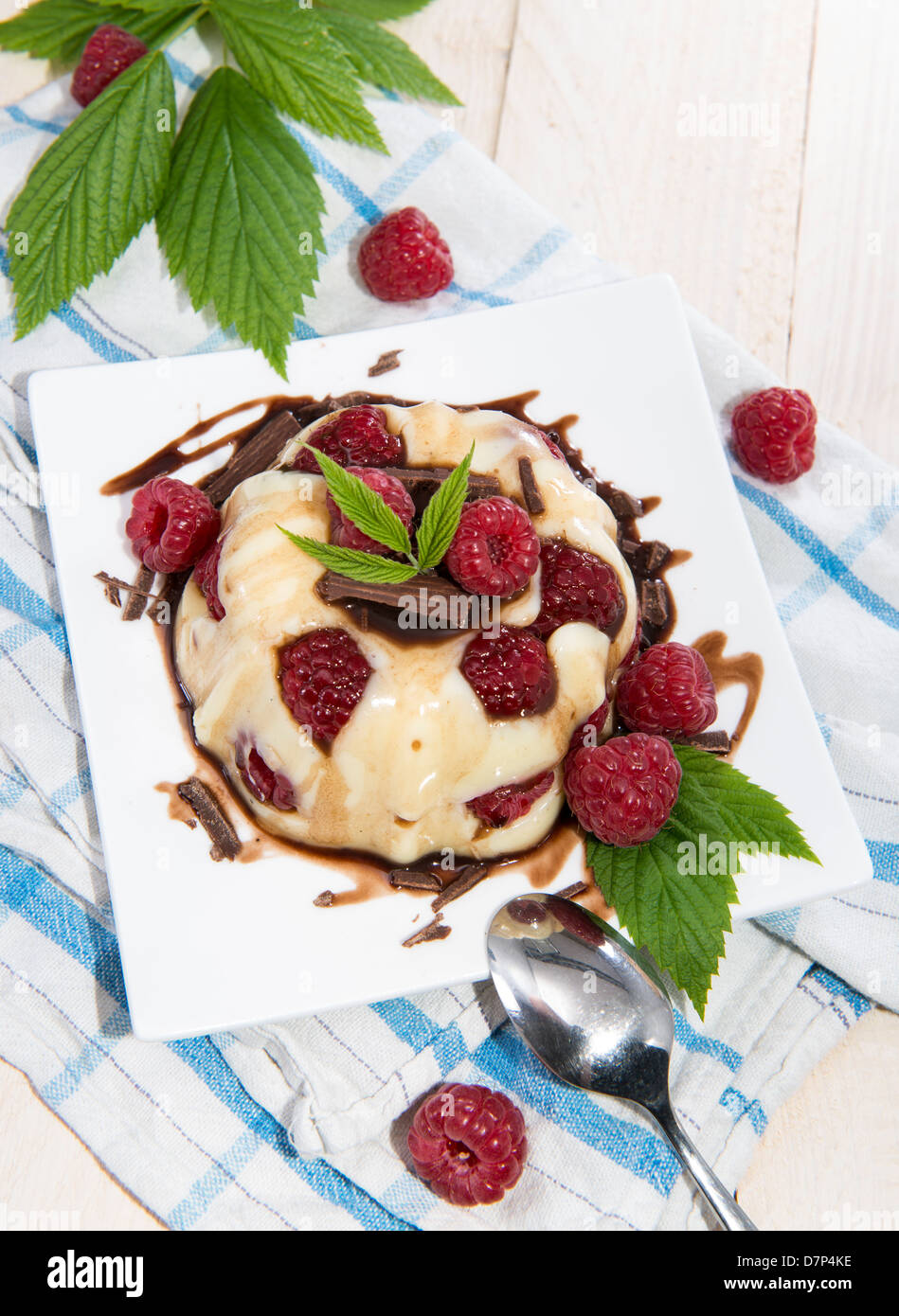 Pudding Dessert with Chocolate Sauce and fresh Berries on wooden ...