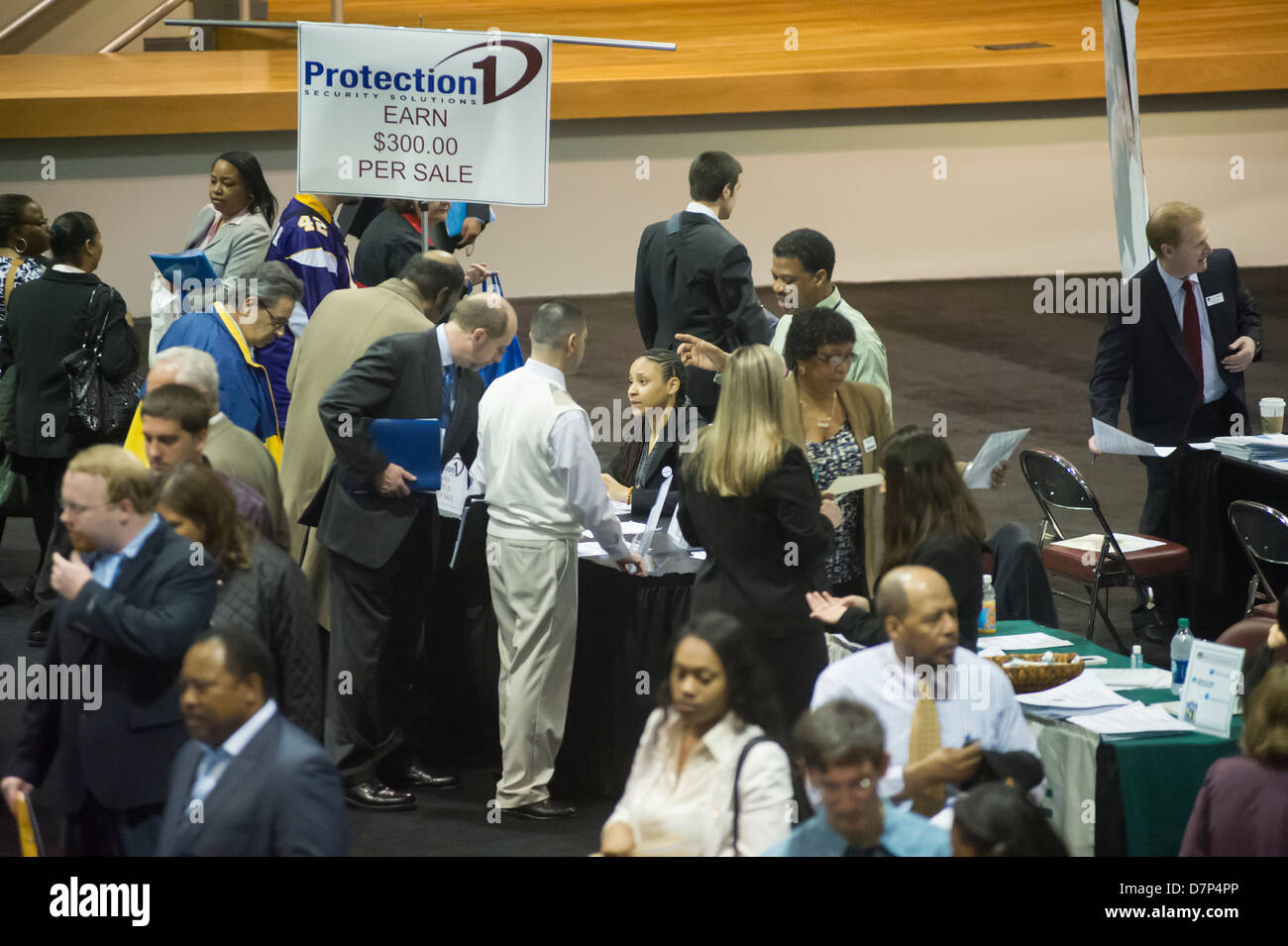 Job seekers attend a job fair at the Jacob Javits Convention Center in ...