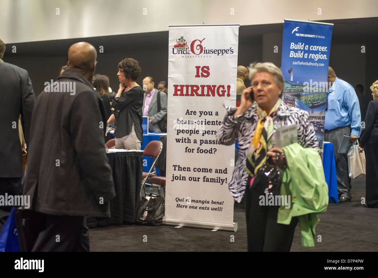 Job seekers attend a job fair at the Jacob Javits Convention Center in ...