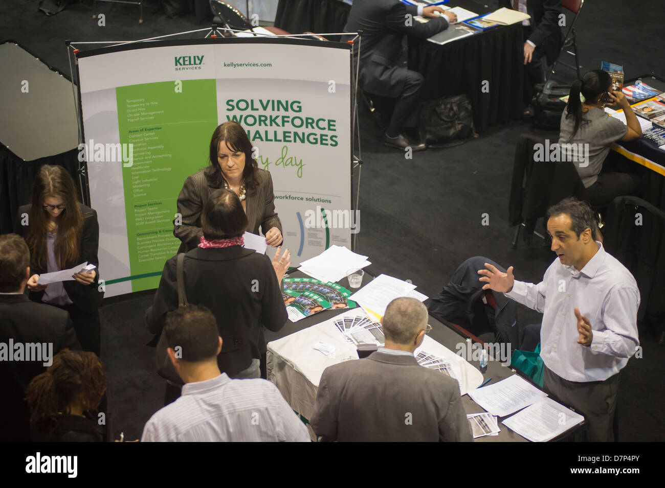 Job seekers attend a job fair at the Jacob Javits Convention Center in ...