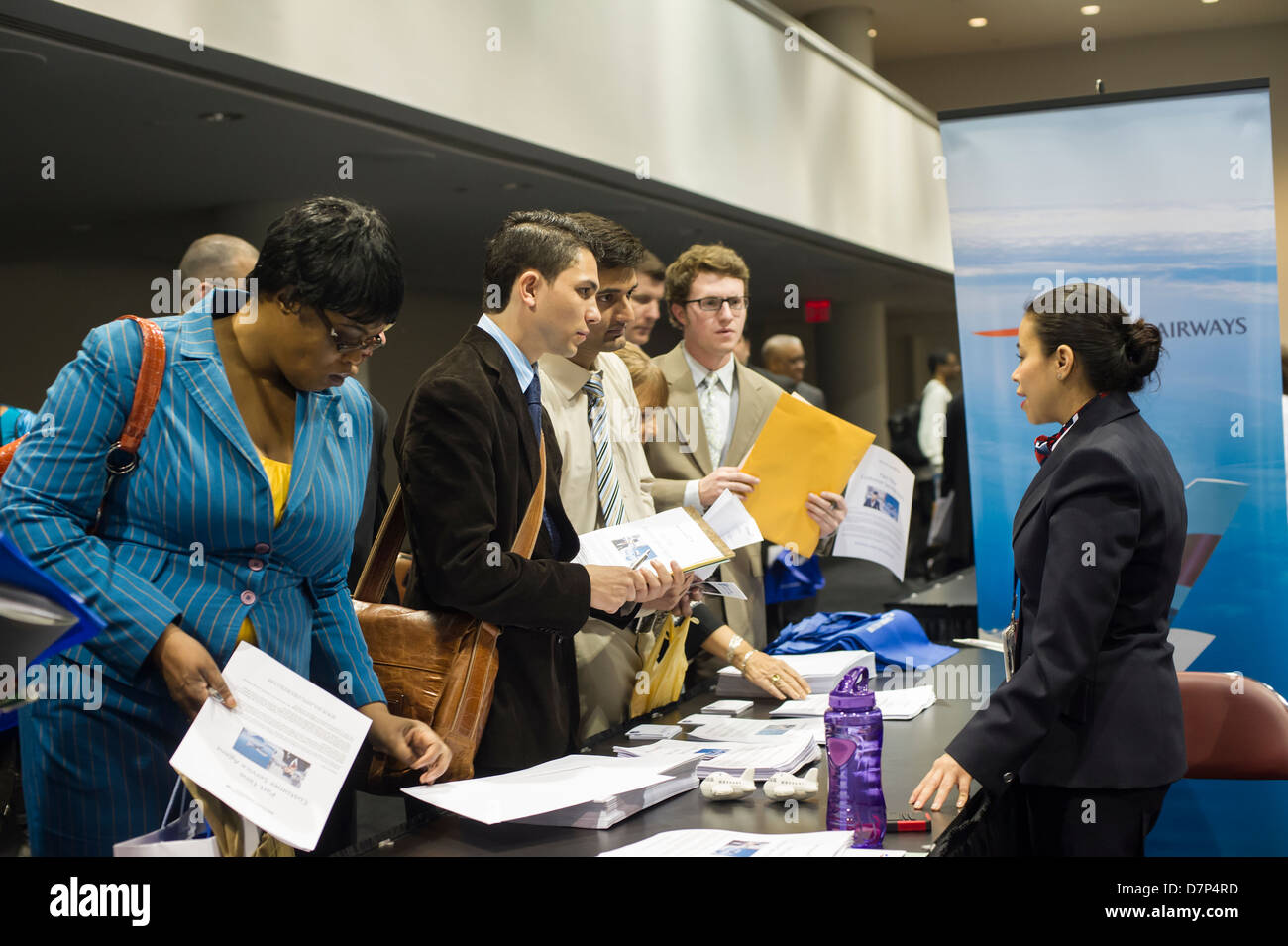 Job seekers attend a job fair at the Jacob Javits Convention Center in ...