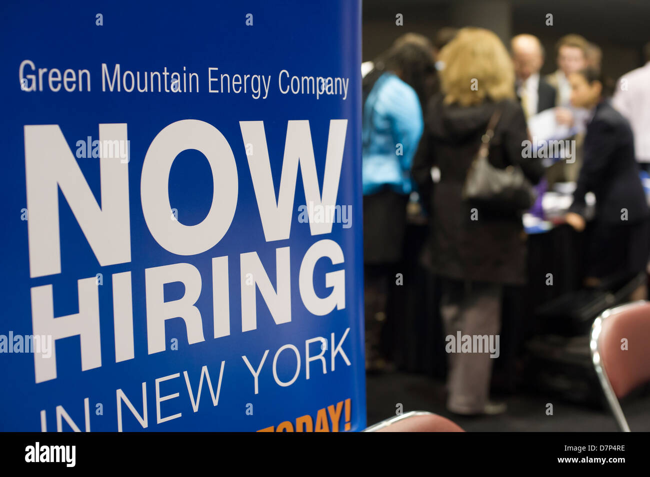 Job seekers attend a job fair at the Jacob Javits Convention Center in ...