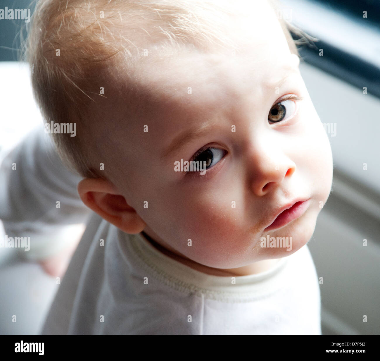 Close up portrait of baby looking up Stock Photo - Alamy