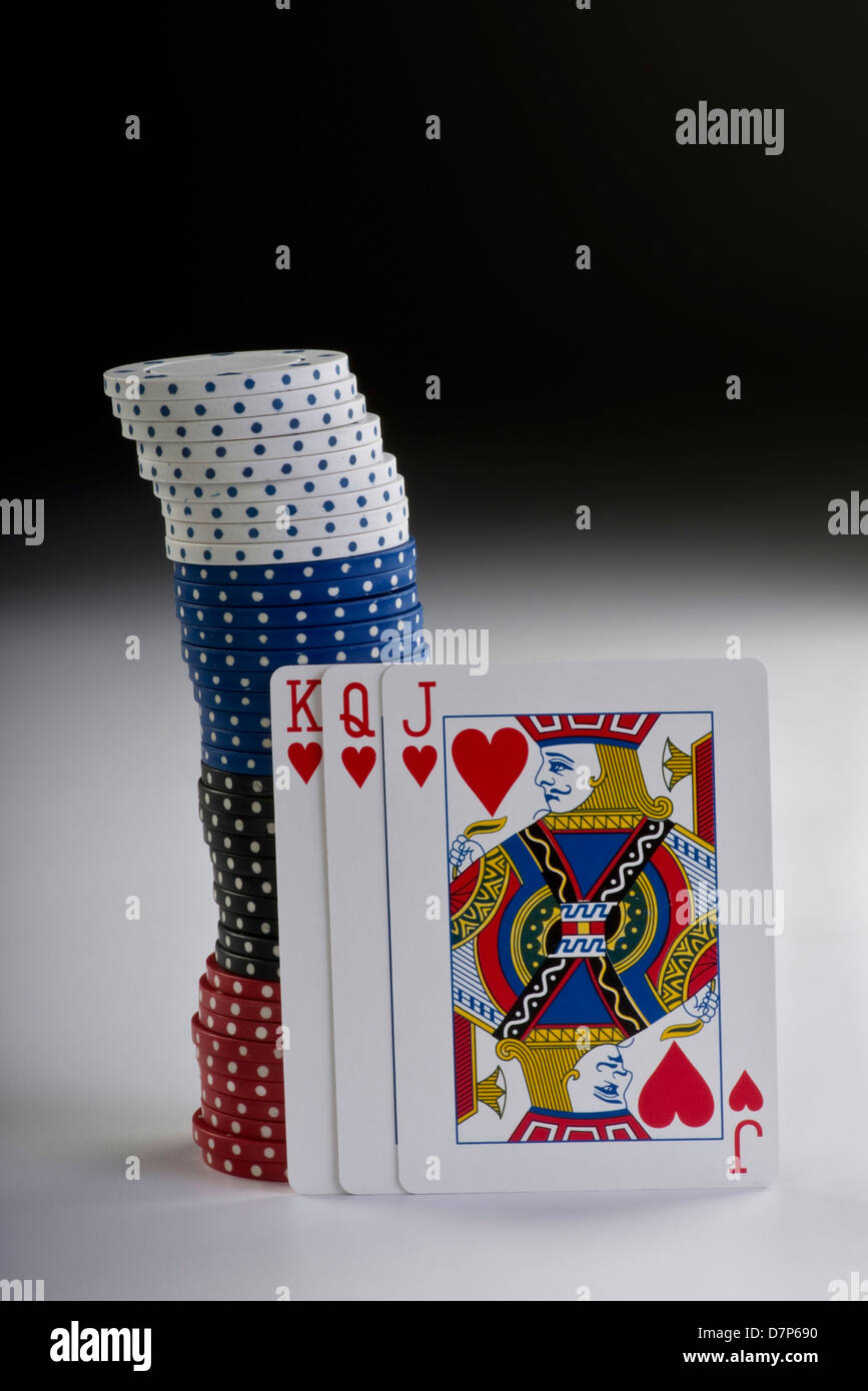 Card hand and stack of chips Stock Photo - Alamy