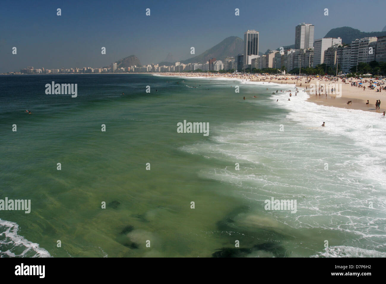 Sunbathers enjoy Leme Beach on a sunny autumn day. Rio de Janeiro ...