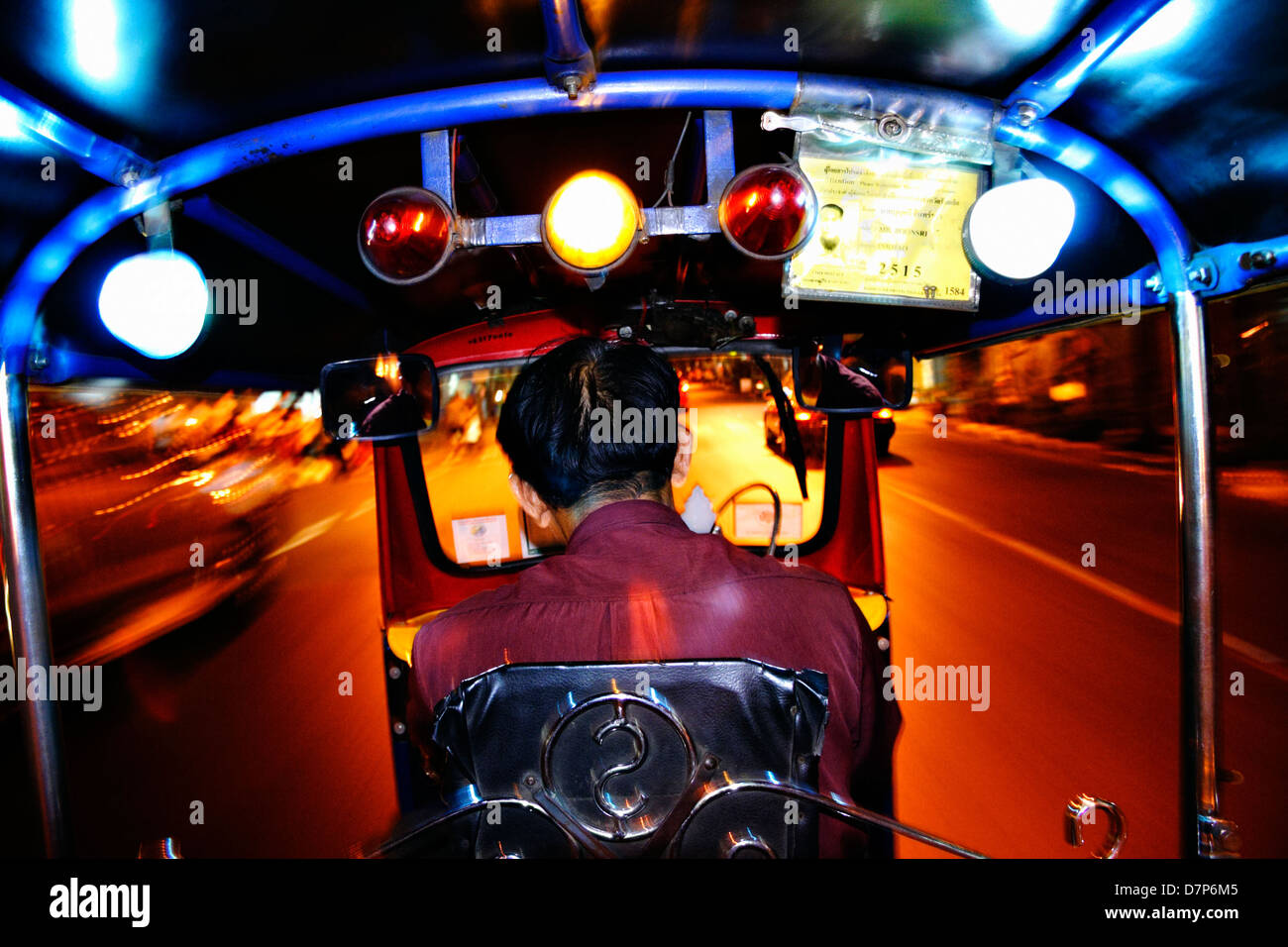 View fom inside a Thai tuk tuk auto rickshaw driving fast through ...