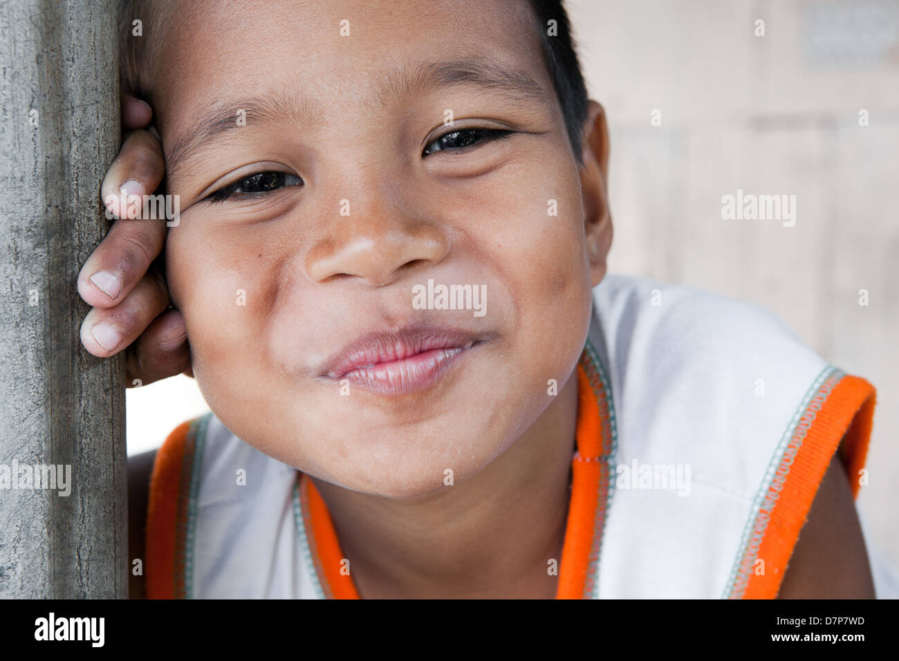 Portrait of a smiling boy in the Philippines from an impoverished ...