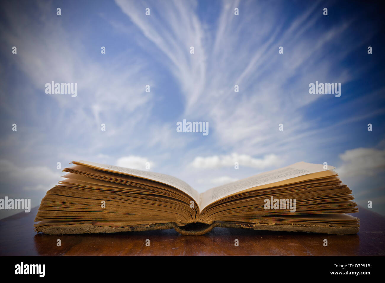 Open book on wood planks over sky background Stock Photo - Alamy