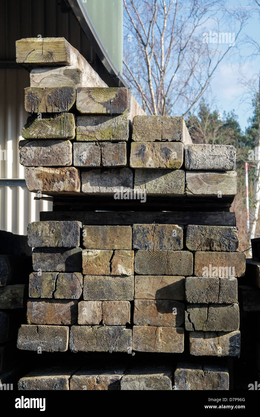 An end view of a stack of used railway sleepers Stock Photo - Alamy