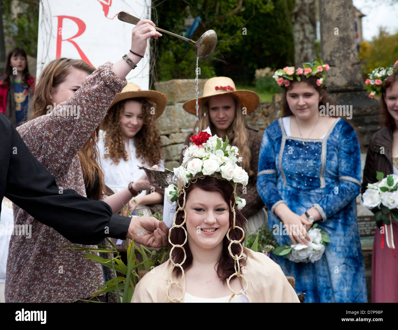 The May Queen being doused with water during May Day Festival in ...