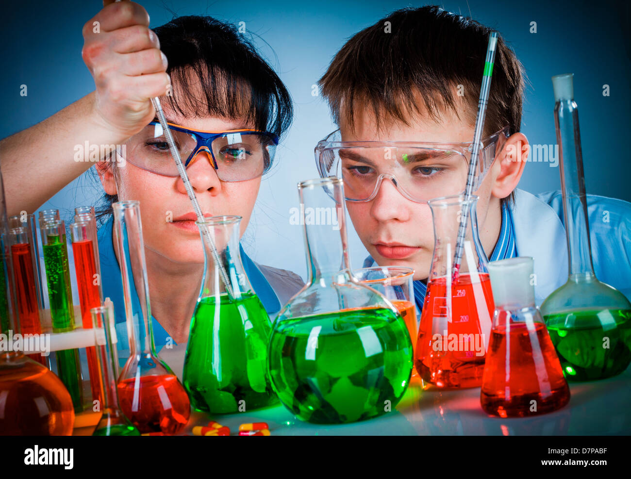 schoolteacher and student working in the lab Stock Photo - Alamy