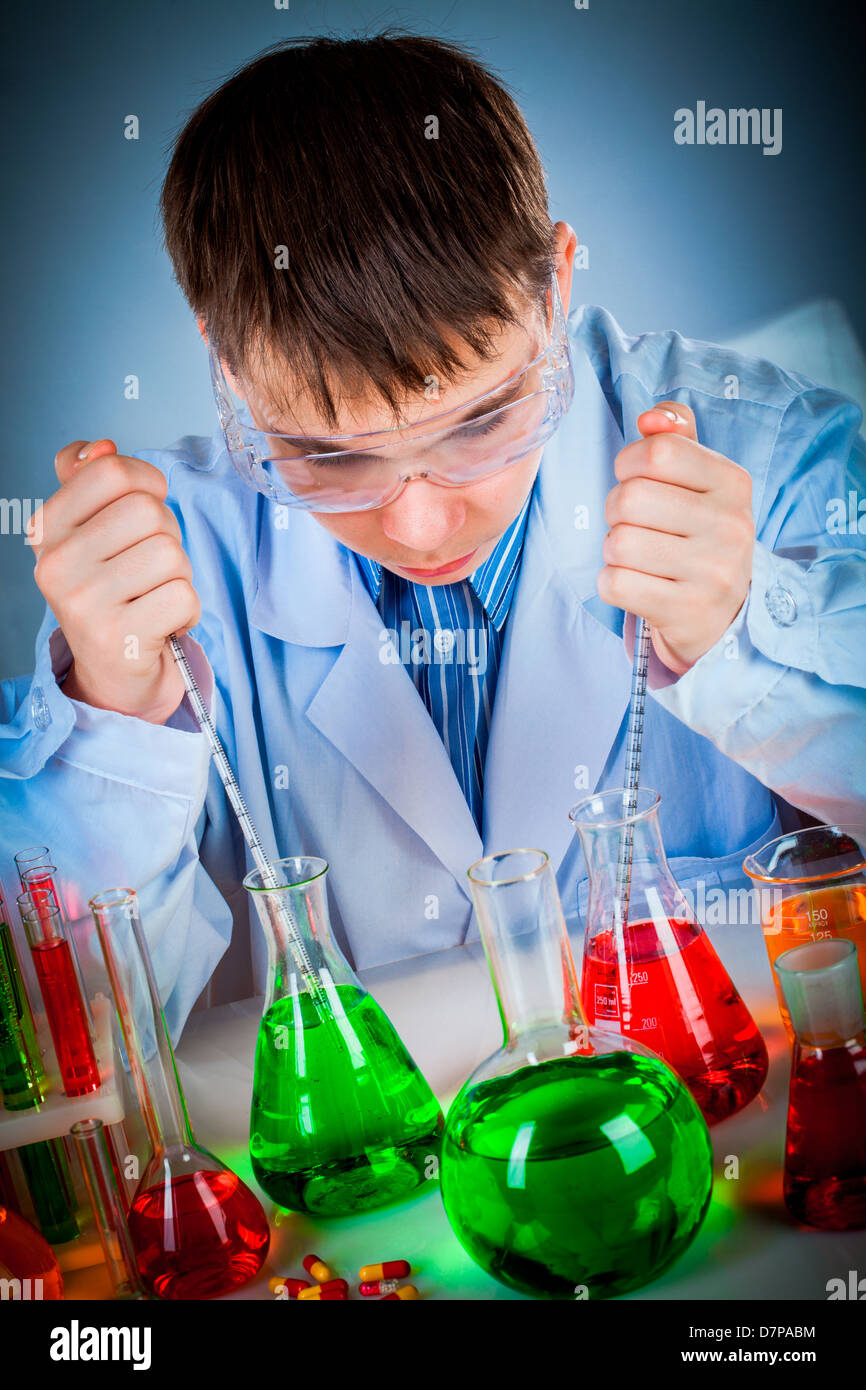 School boy working in laboratory hi-res stock photography and images ...