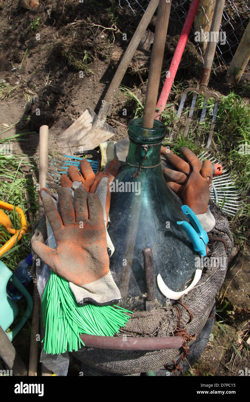 gardening tools on allotment patch in italy Stock Photo - Alamy