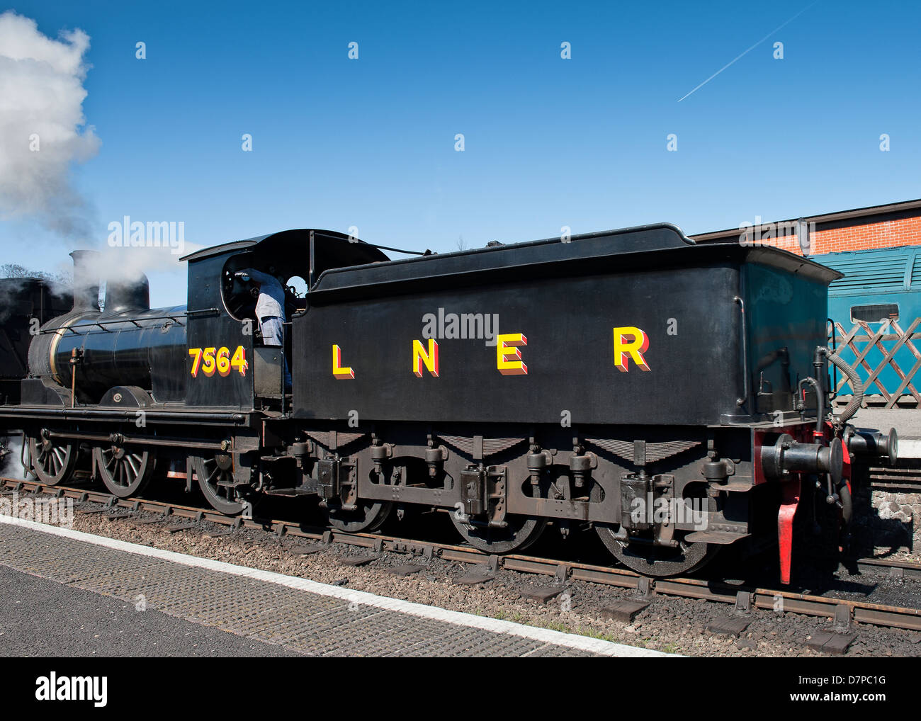 Steam railway engine leaving Sherringham Railway station Stock Photo ...
