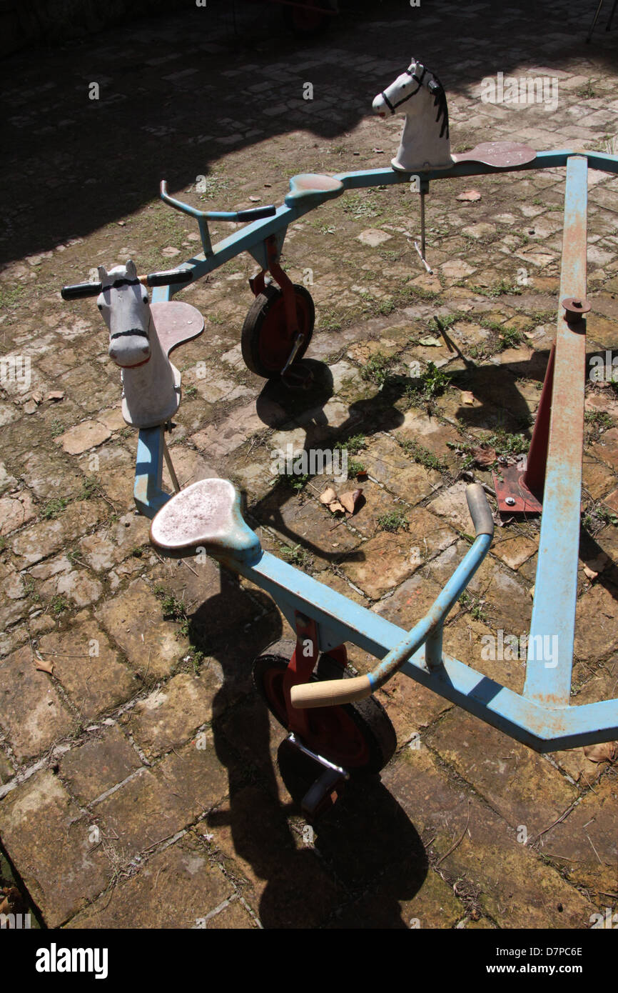 old roundabout ride in play ground on farm near rome italy Stock Photo ...
