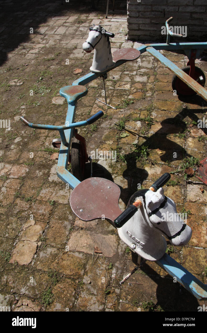 old roundabout ride in play ground on farm near rome italy Stock Photo ...