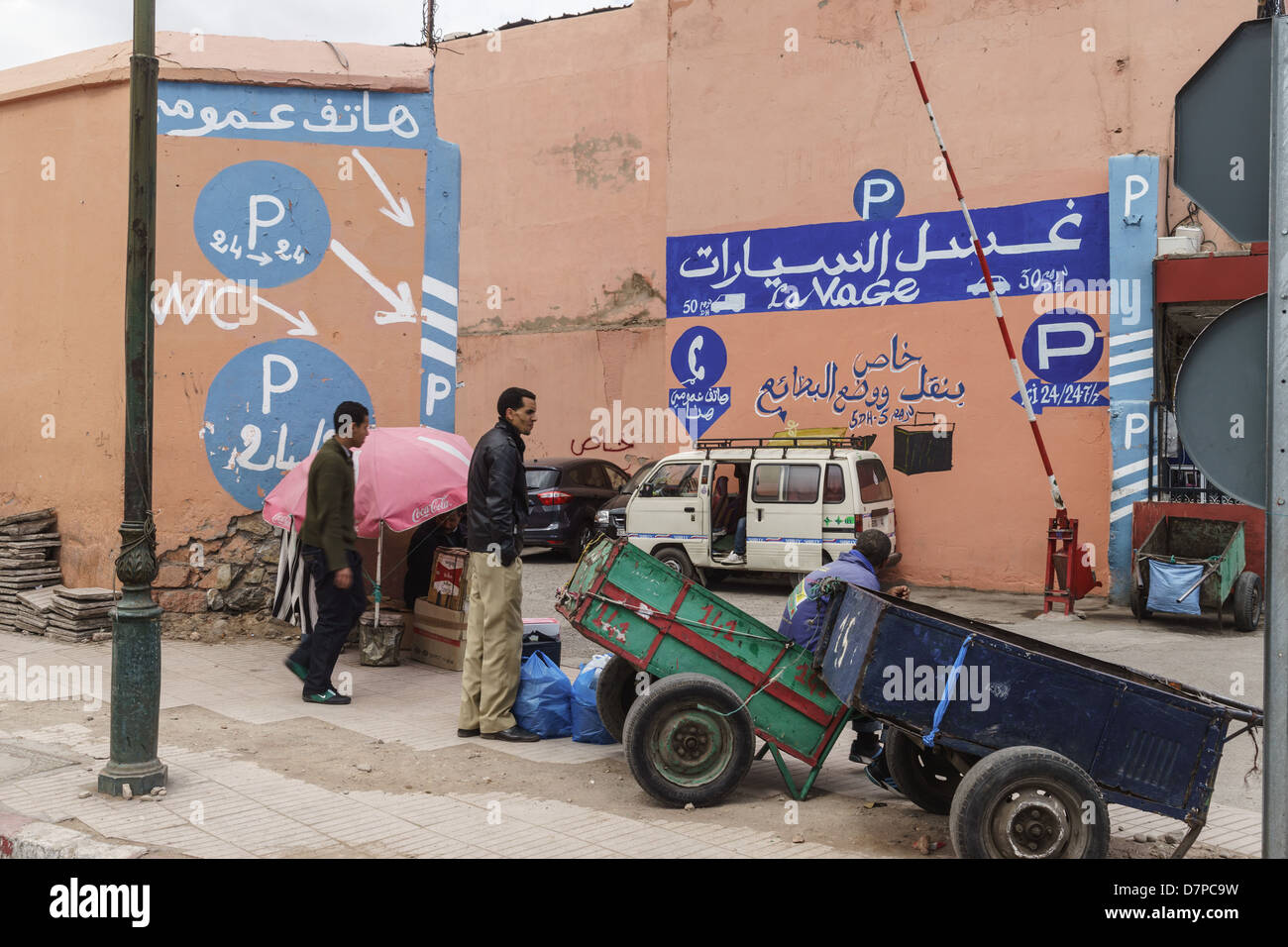 Morocco, Marrakesh - tradesmen's entrance, parking signs, business near ...