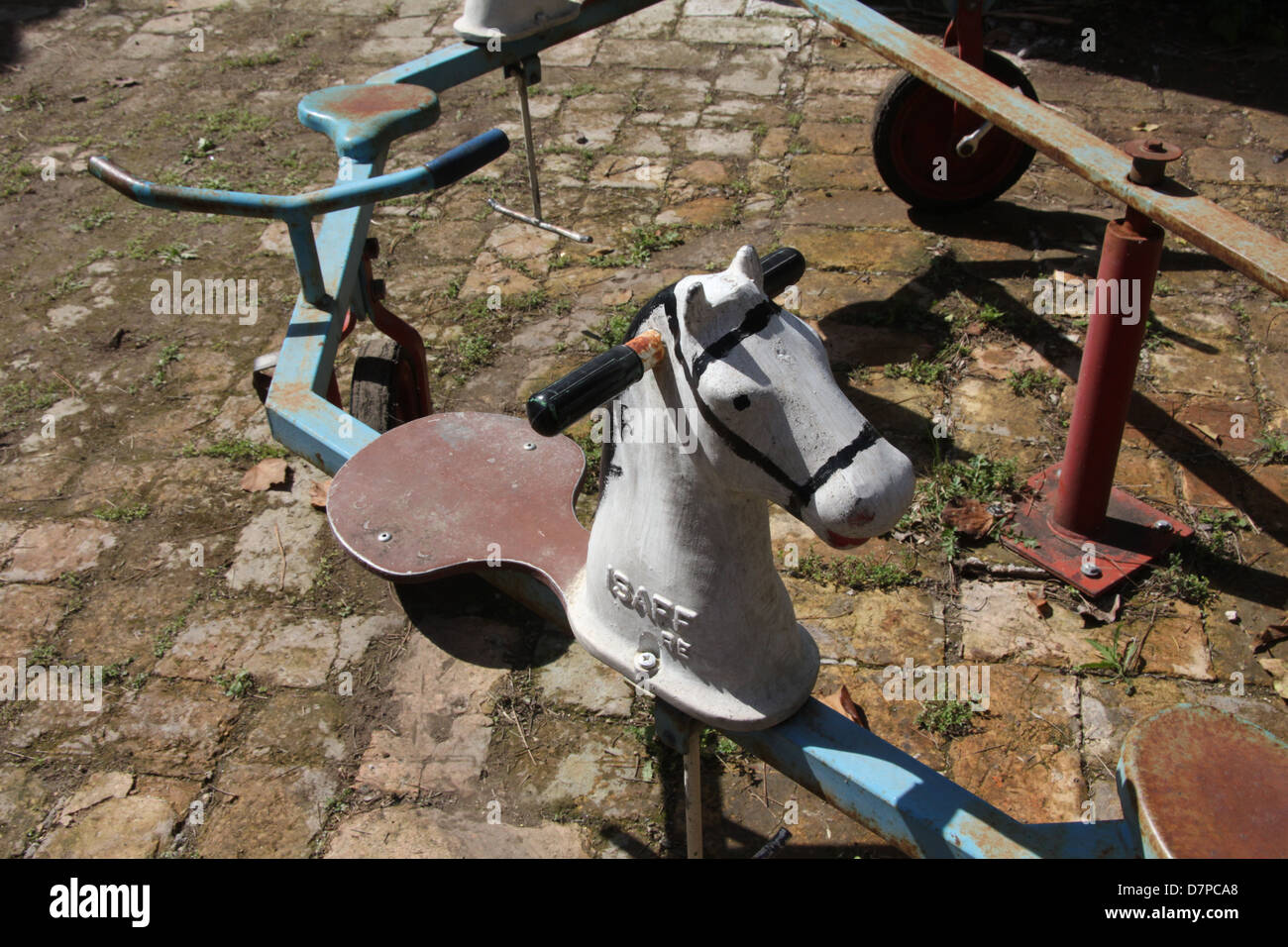 old roundabout ride in play ground on farm near rome italy Stock Photo ...