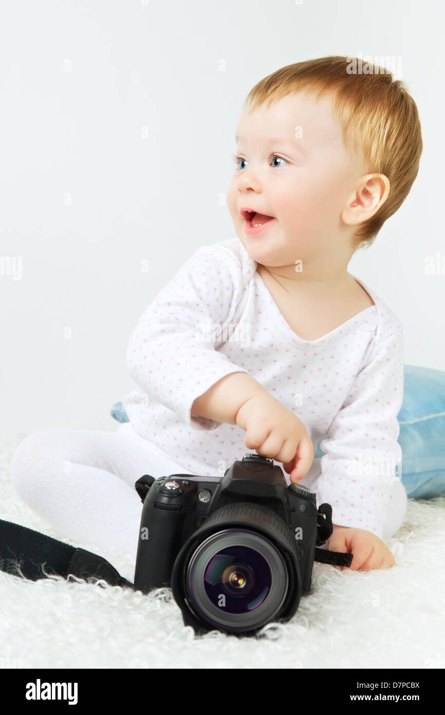 beautiful little blond baby with dslr camera Stock Photo - Alamy