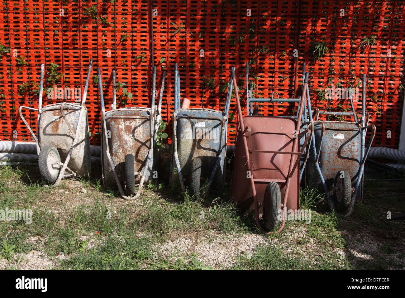 lots of wheelbarrows on building site Stock Photo - Alamy