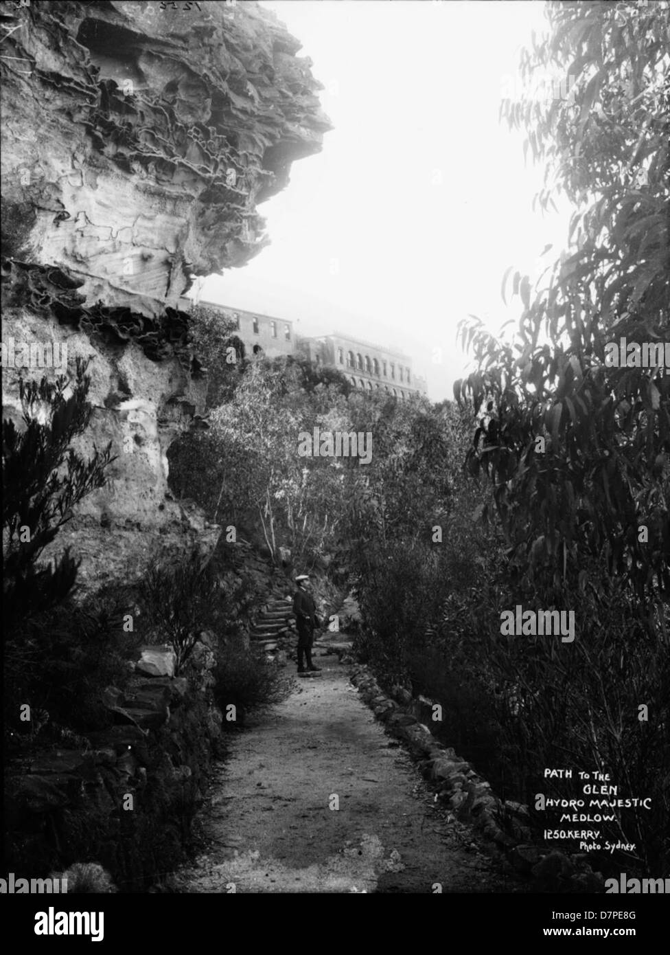 This historical black-and-white photograph captures the scenic path to ...