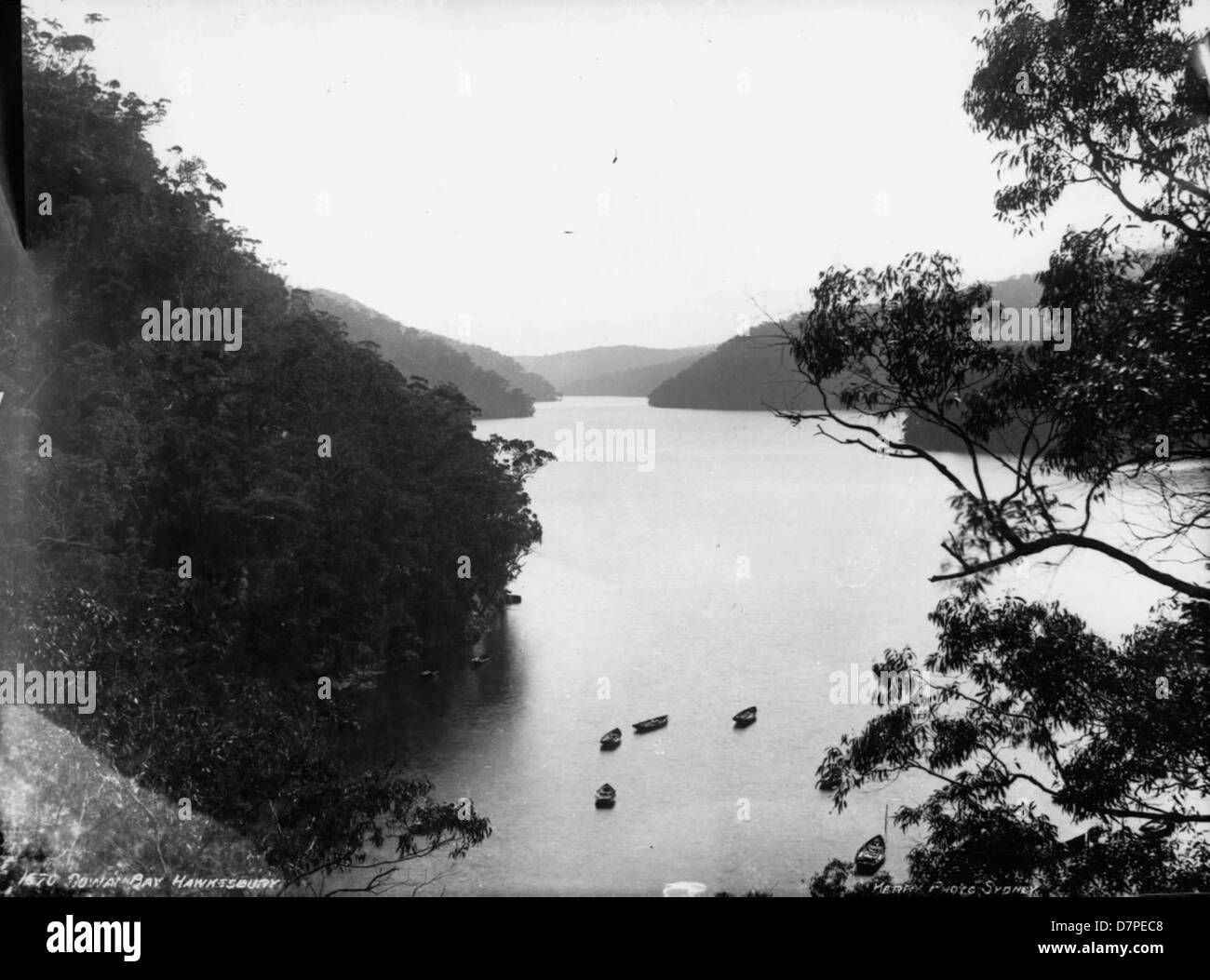 This image shows boats on Cowan Bay, located in the Hawkesbury River ...