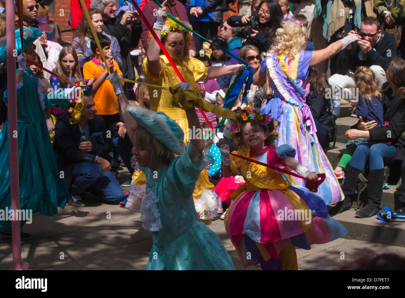 London, UK. 12th May 2013. Maypole dancers helped create a scene ...