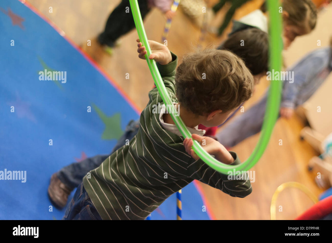 a child playing with a hoop Stock Photo - Alamy