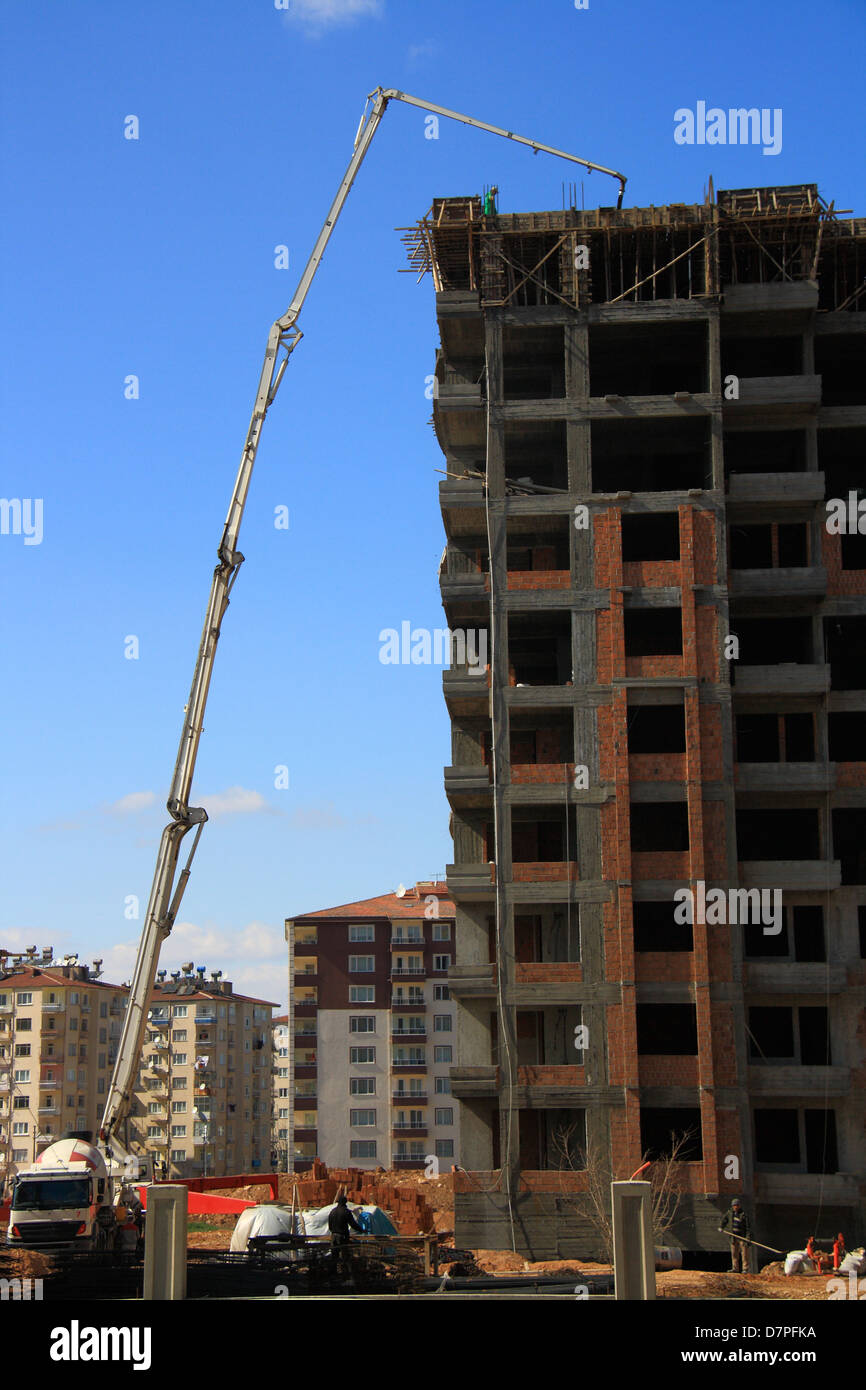 construction of building with cement mixture machine Stock Photo - Alamy