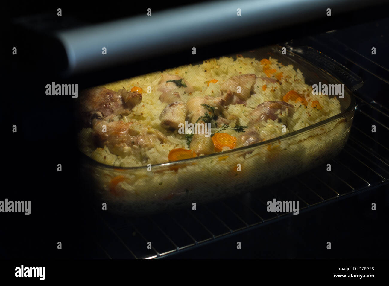 Chicken meat with rice baked in the oven Stock Photo - Alamy