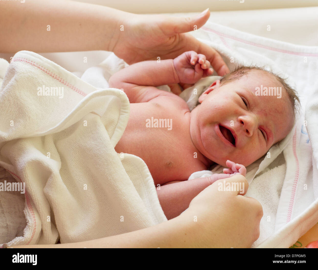 Newborn baby girl with colic problem crying Stock Photo - Alamy