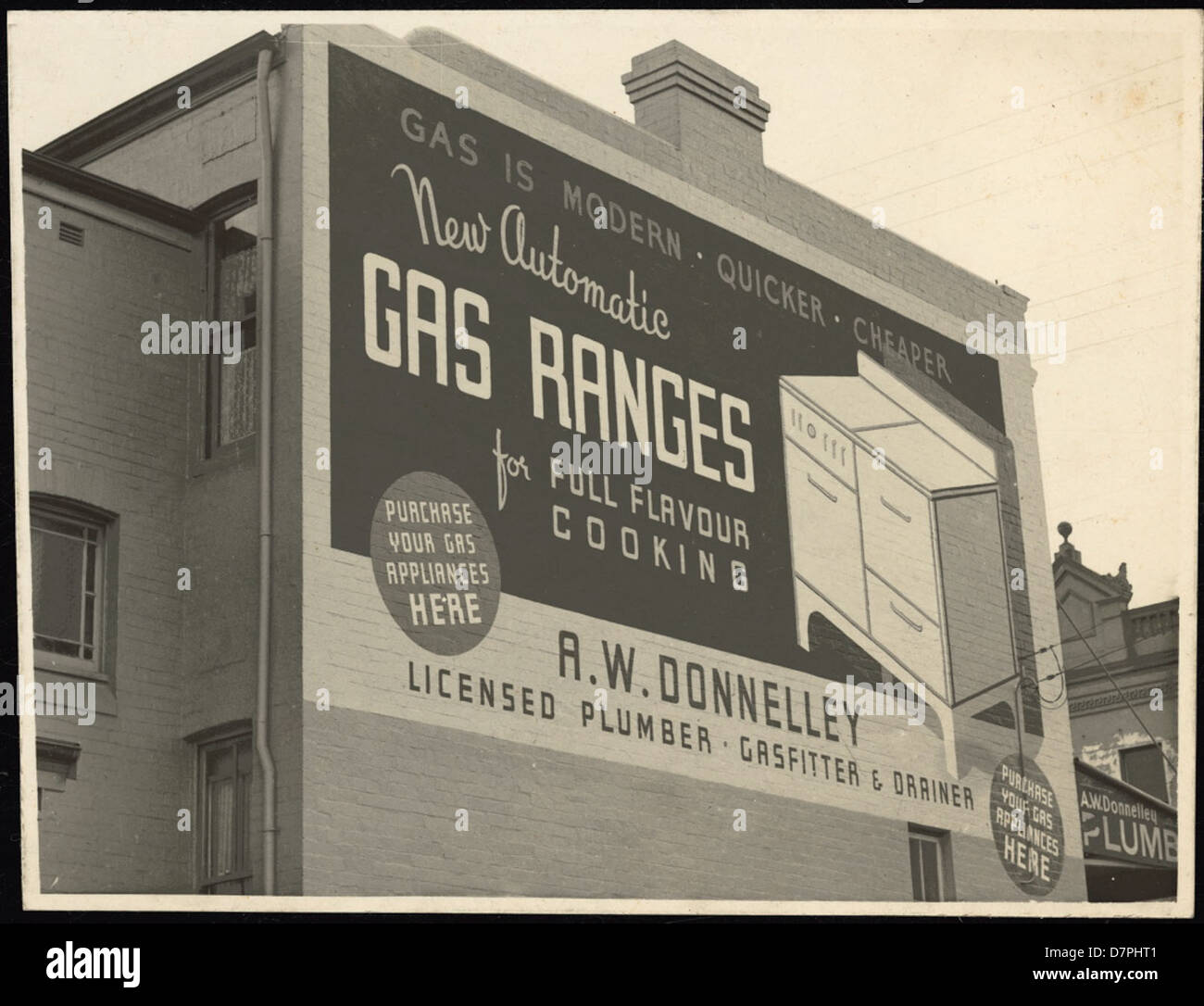 A vintage 1930s billboard advertisement showcases a gas oven ...