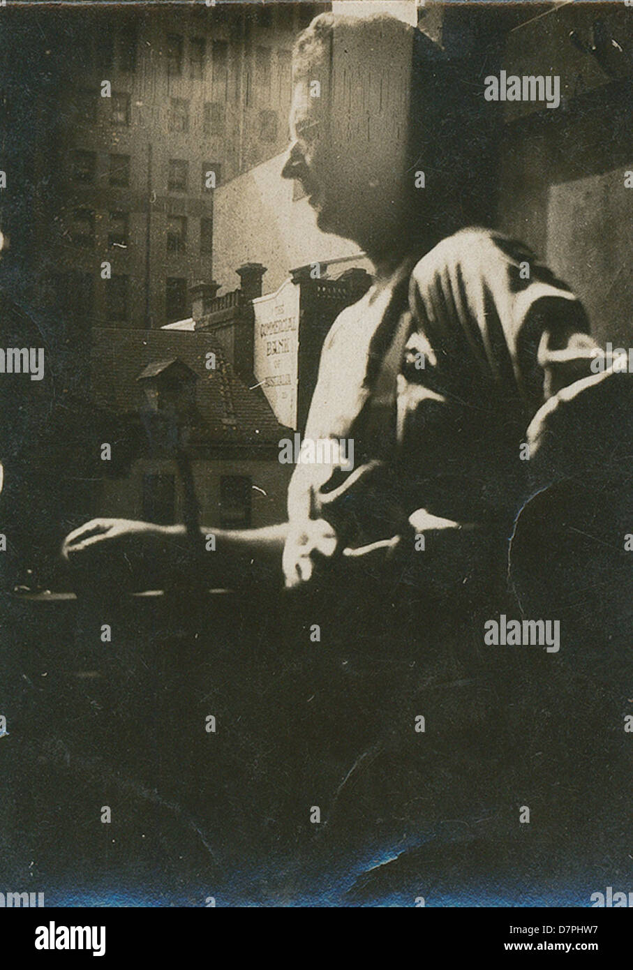 This photograph captures a man at the window of the projection box at ...