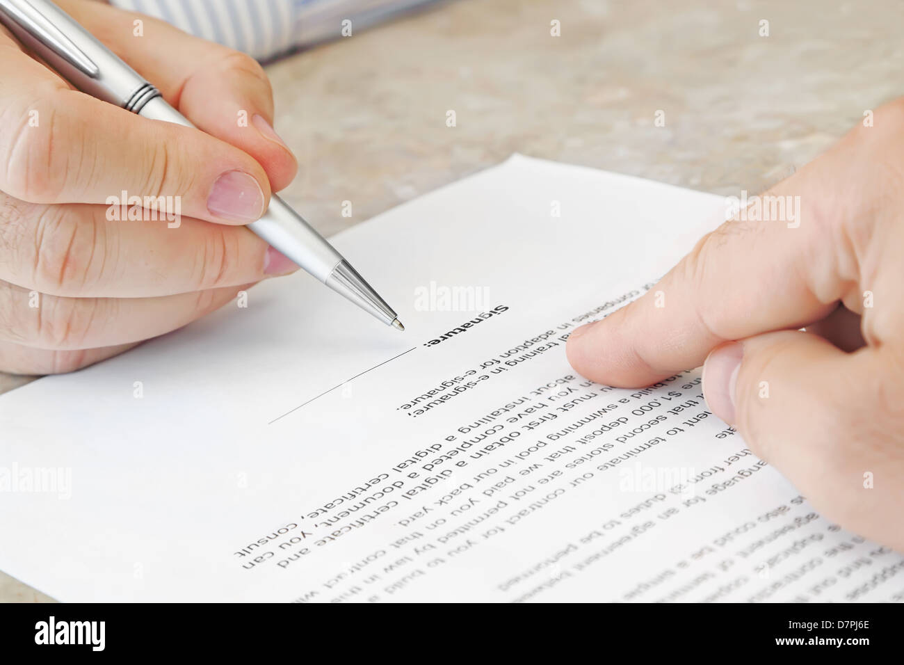 Signing a Document Stock Photo - Alamy